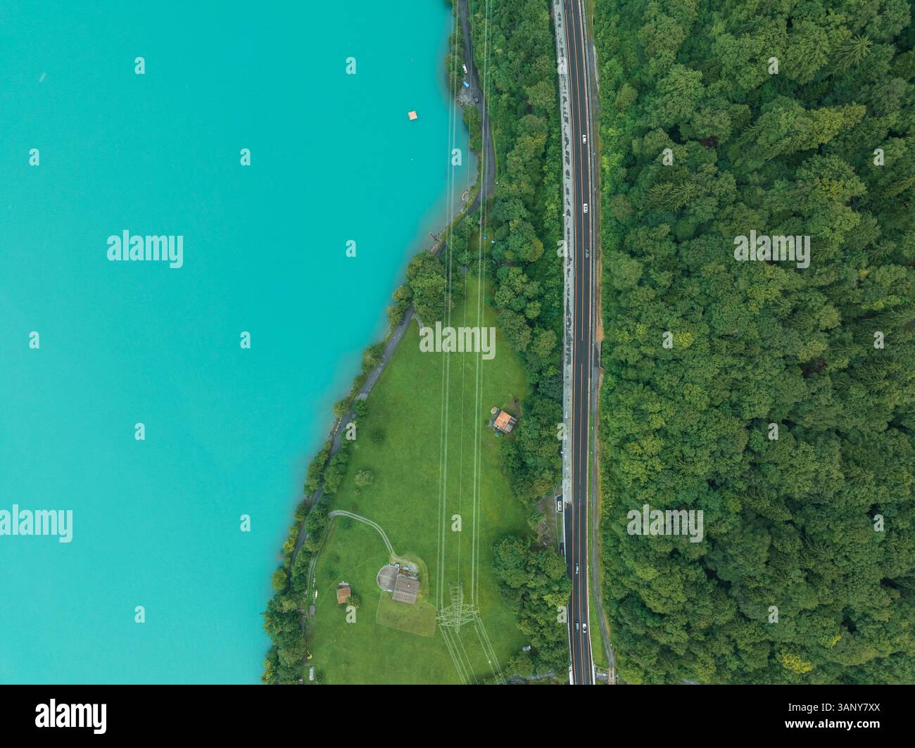 Aerial view of a road following the Brienzersee Lake coastline, Bonigen ...