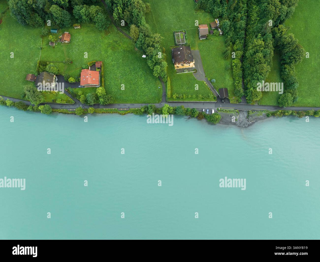 Aerial view of a road following the Brienzersee Lake coastline, Bonigen ...