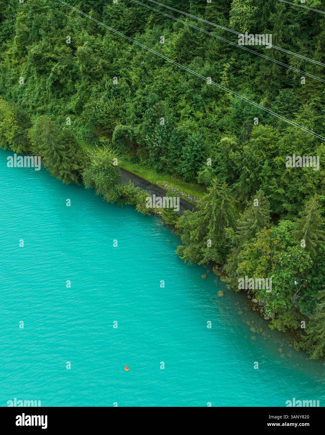 Aerial view of a trail following the Brienzersee Lake coastline ...