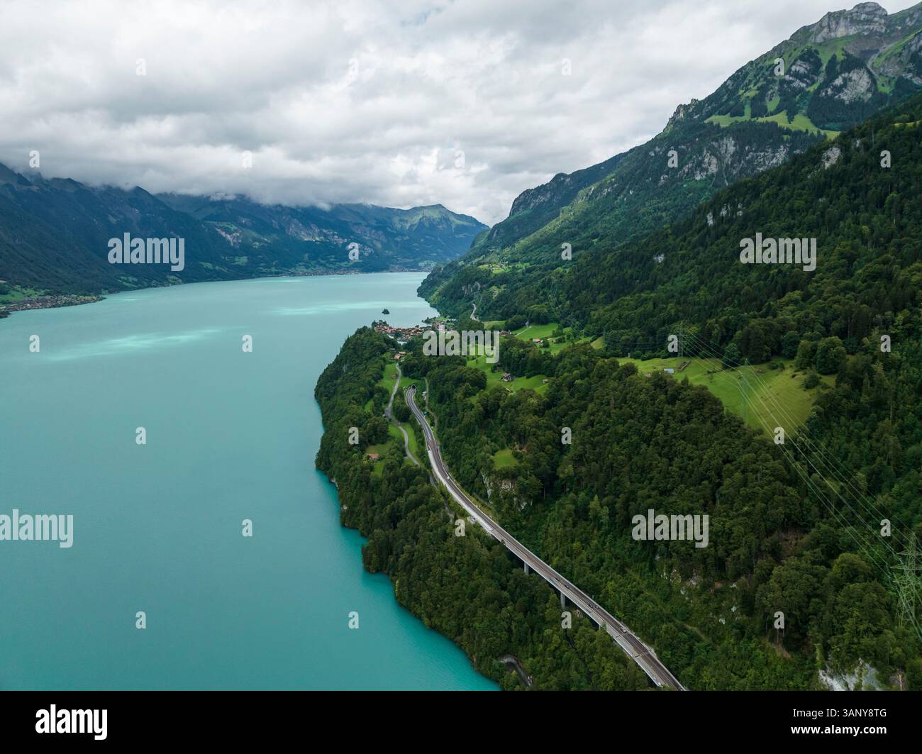 Aerial view of a road following the Brienzersee Lake coastline, Bonigen ...