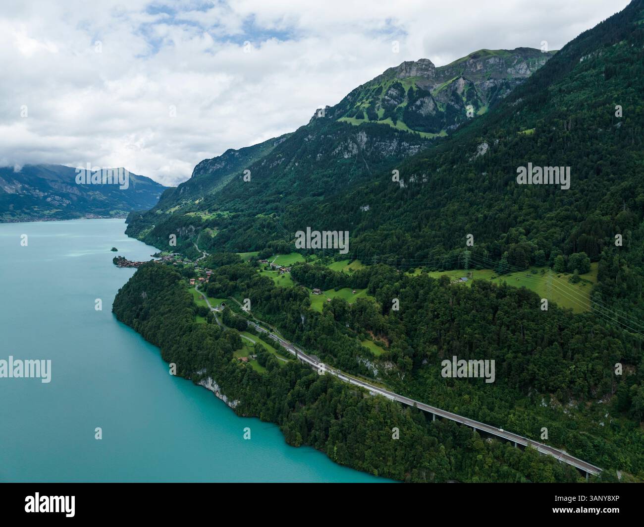 Aerial view of a road following the Brienzersee Lake coastline, Bonigen ...