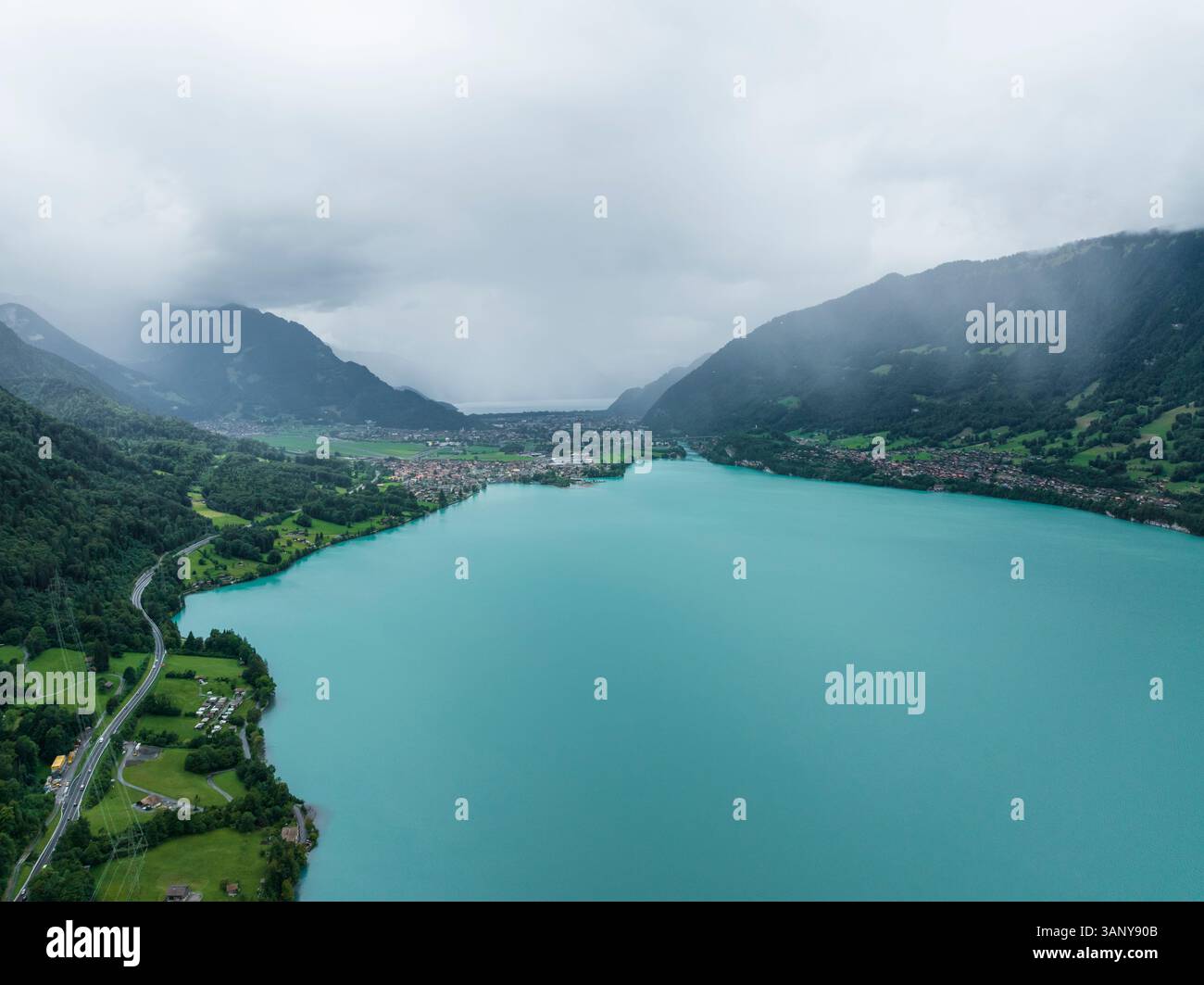 Aerial view of a road following the Brienzersee Lake coastline, Bonigen ...