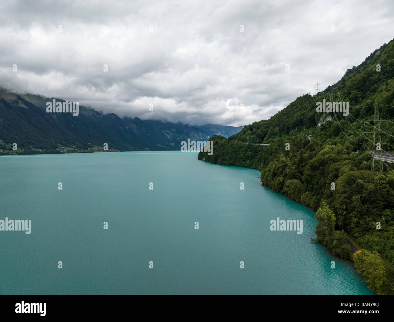Aerial view of a road following the Brienzersee Lake coastline, Bonigen ...