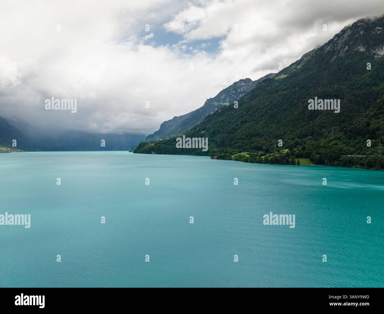 Aerial view of Brienzersee Lake in summertime during a rainy day with ...