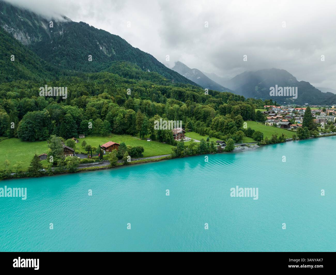 Aerial view of Brienzersee Lake in summertime during a rainy day with ...