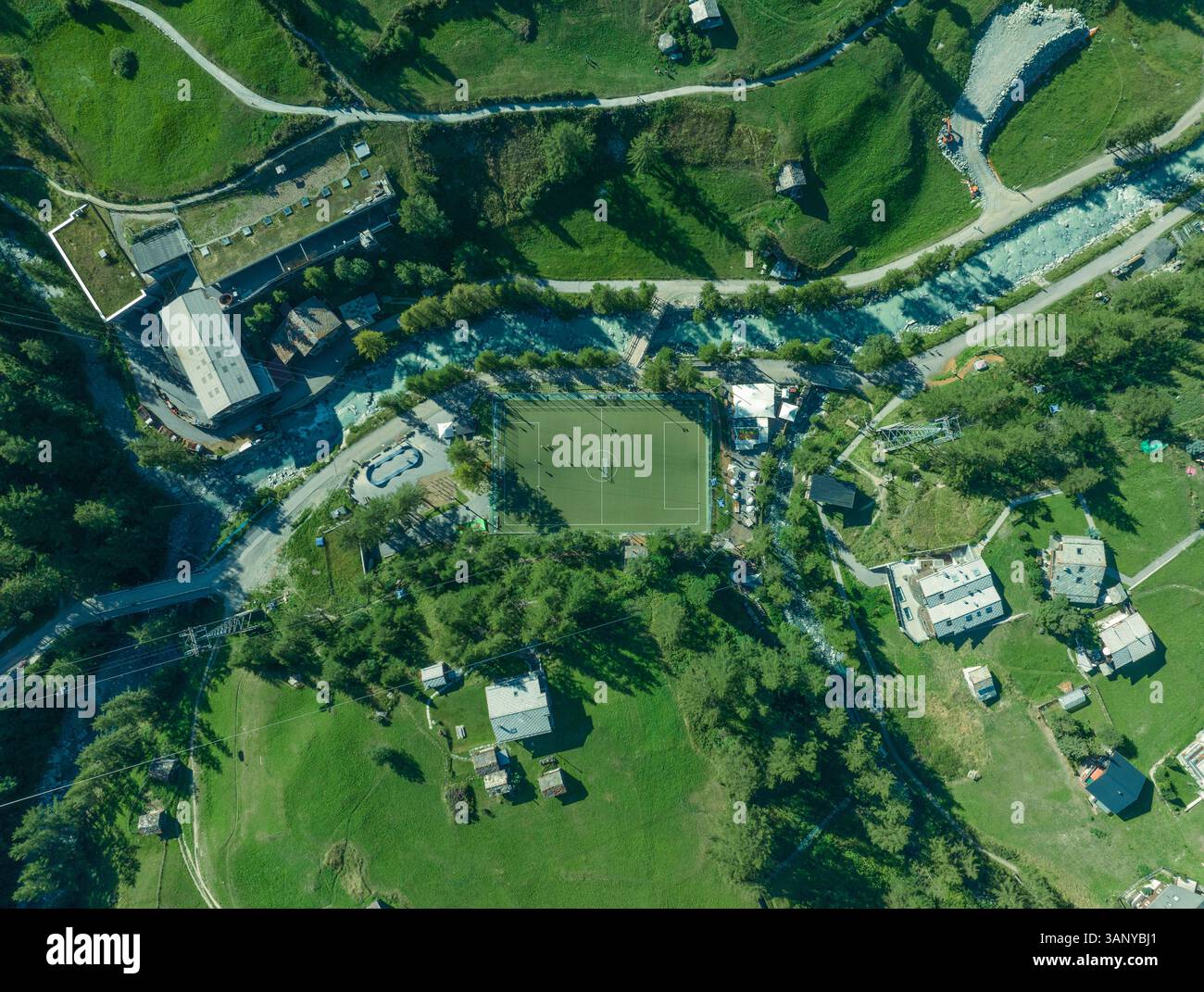 Aerial view of people playing in a football field in Zermatt on the ...