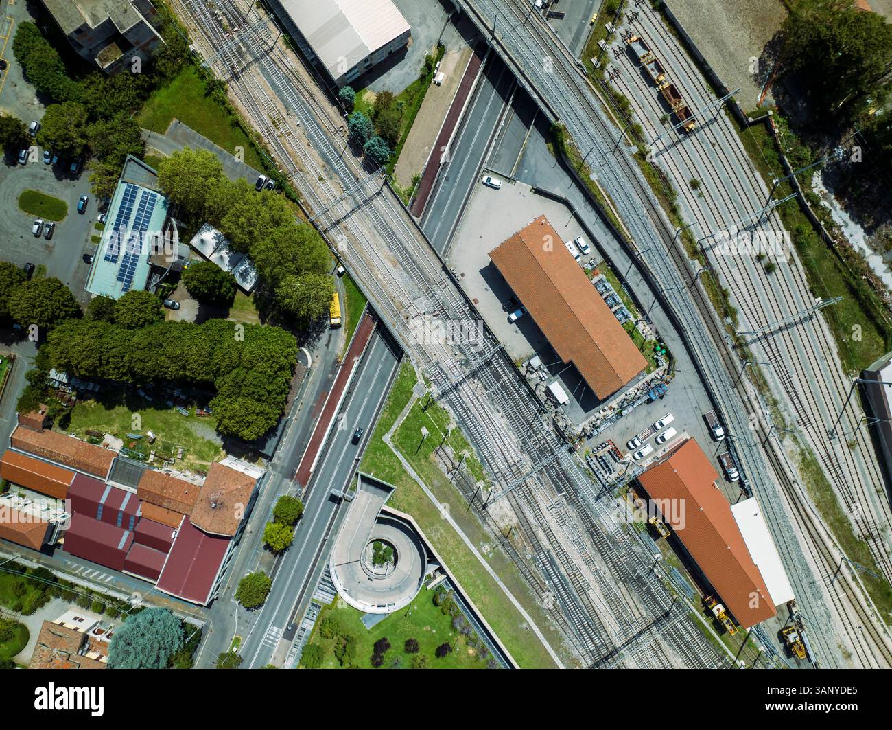 Aerial view of a railway and road intersection in Saronno residential ...