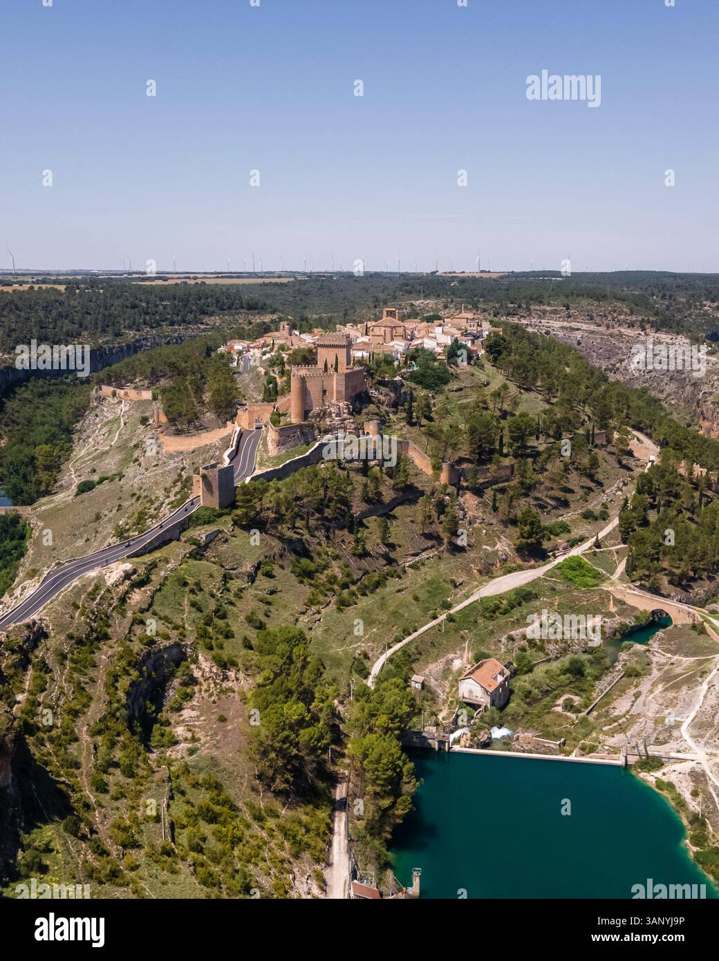 Aerial view of Alarcon, a medieval town with castle on top along the ...