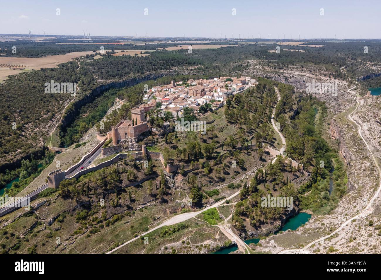 Aerial view of Alarcon, a medieval town with castle on top along the ...