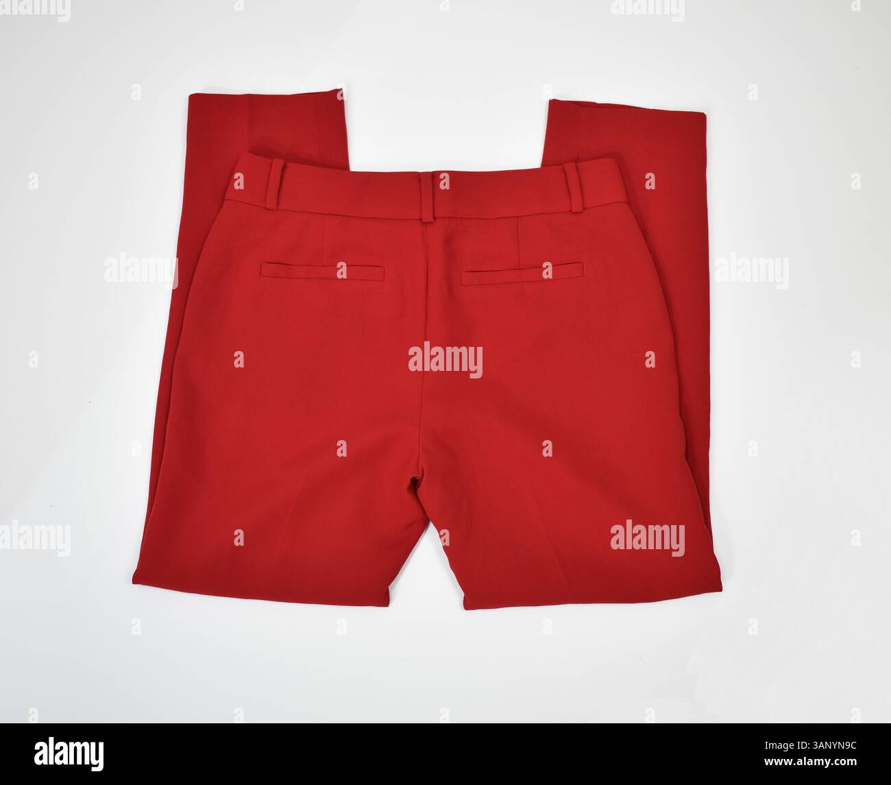 Folded red slacks for office wear on white floor smart casual fashion ...