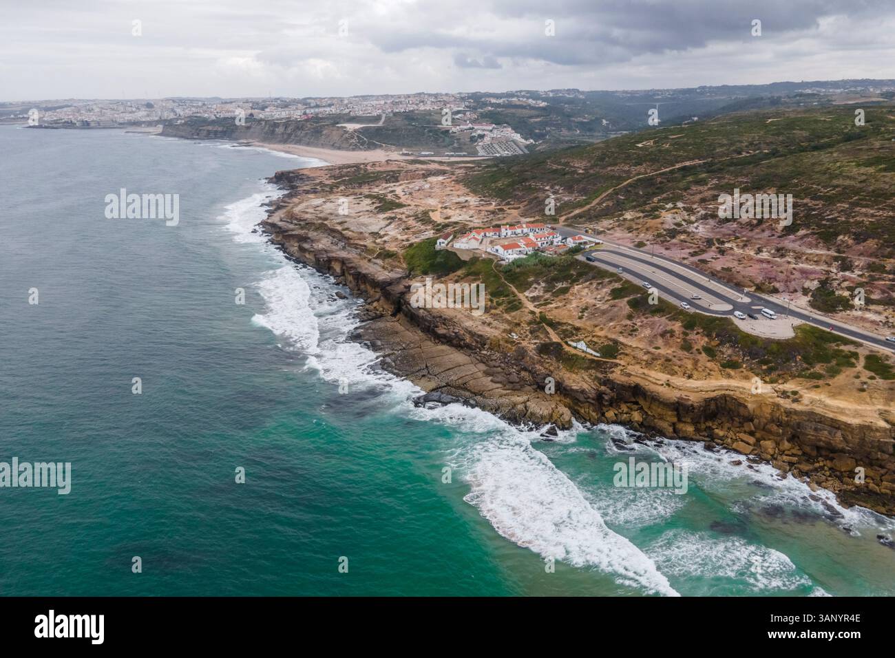 Aerial view of waves breaking on the cliffs along the Atlantic Ocean ...