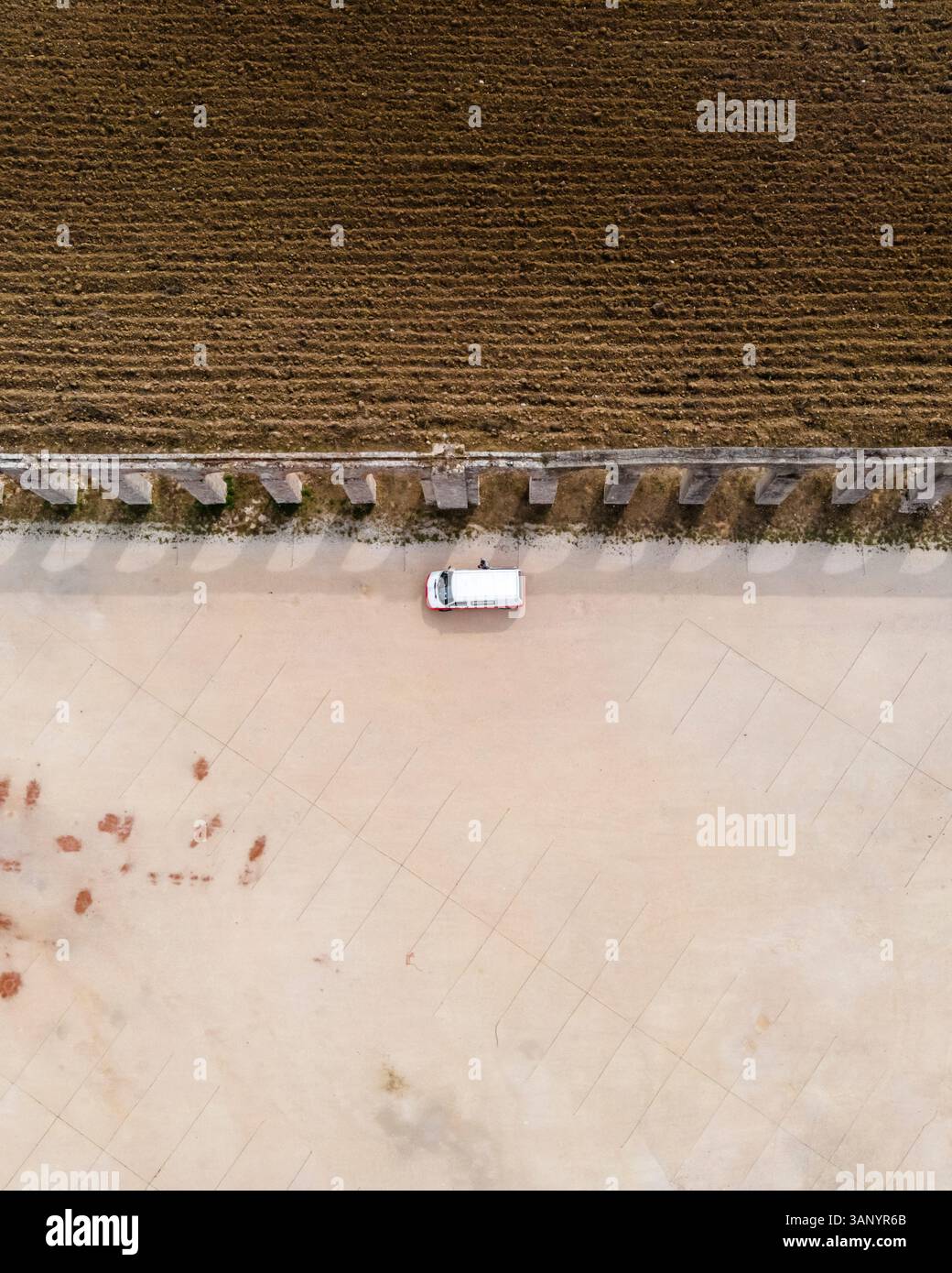 Aerial view of a camper van parking in a parking lot in Obidos near the ...