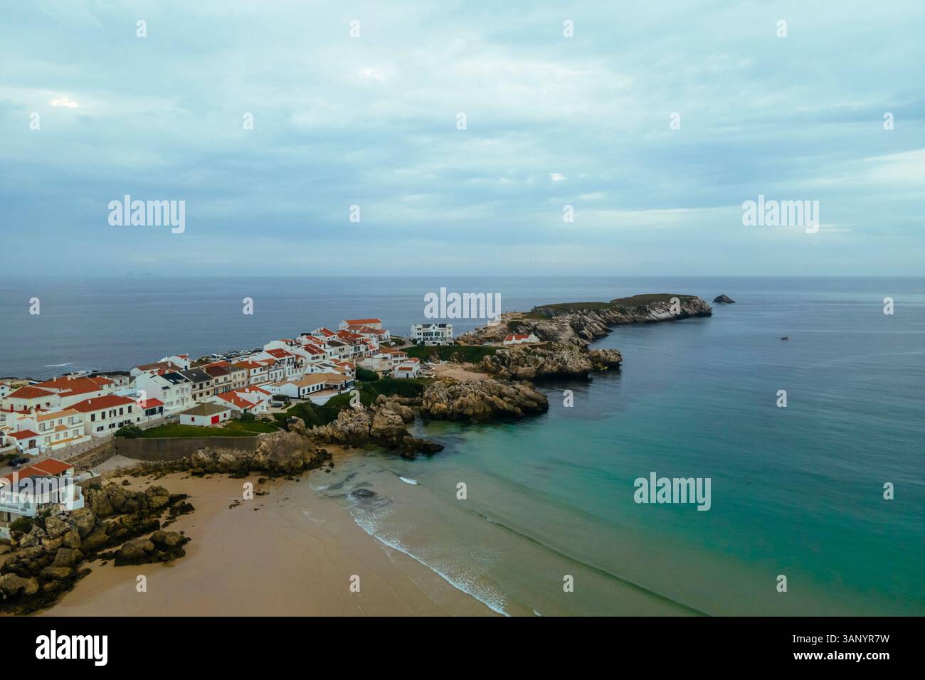 Aerial view of Ilha do Baleal, a small town on island at sunset along ...
