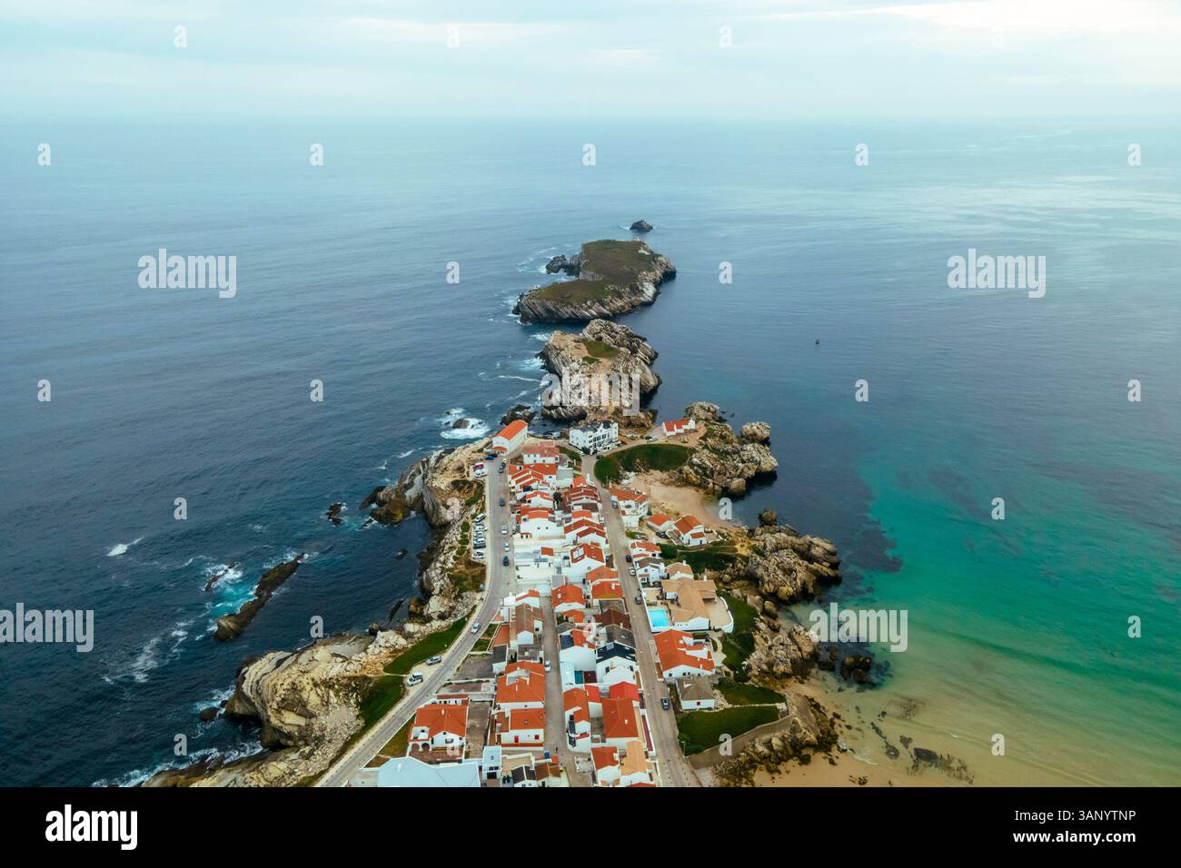 Aerial view of Ilha do Baleal, a small town on island at sunset along ...
