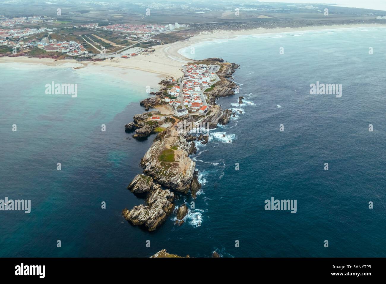Aerial view of Ilha do Baleal, a small town on island at sunset along ...