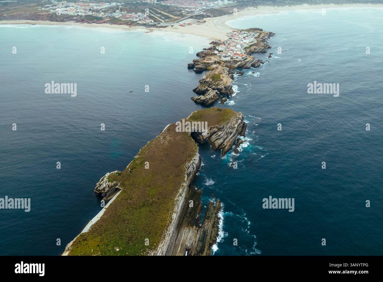 Aerial view of Ilha do Baleal, a small town on island at sunset along ...