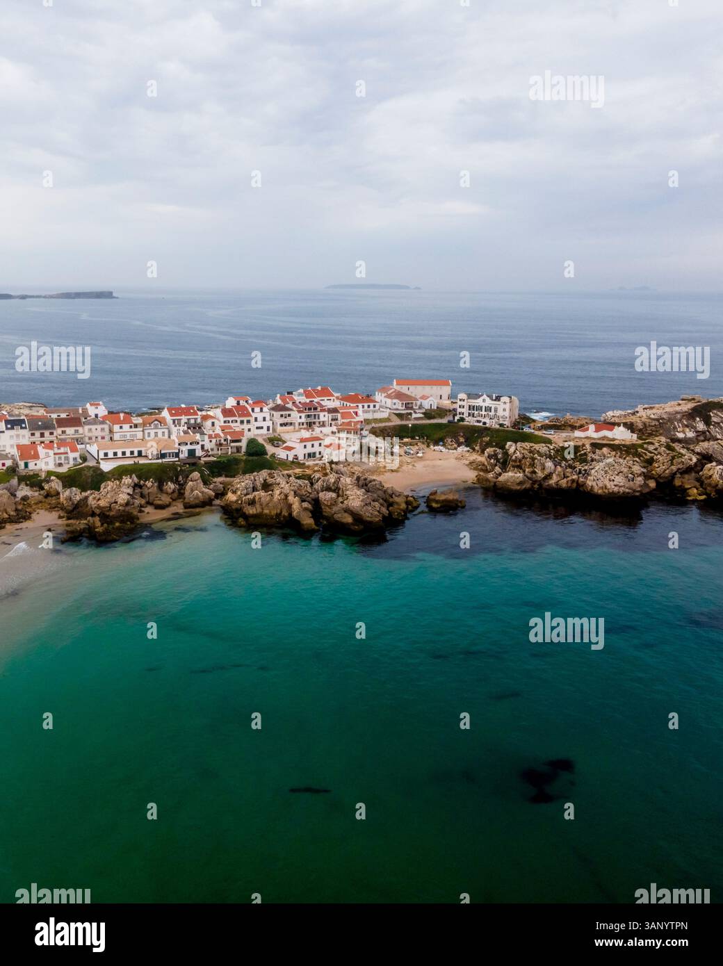 Aerial view of Ilha do Baleal, a small town on island at sunset along ...
