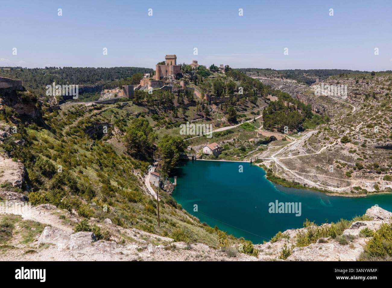 Aerial view of Alarcon, a medieval town with castle on top along the ...
