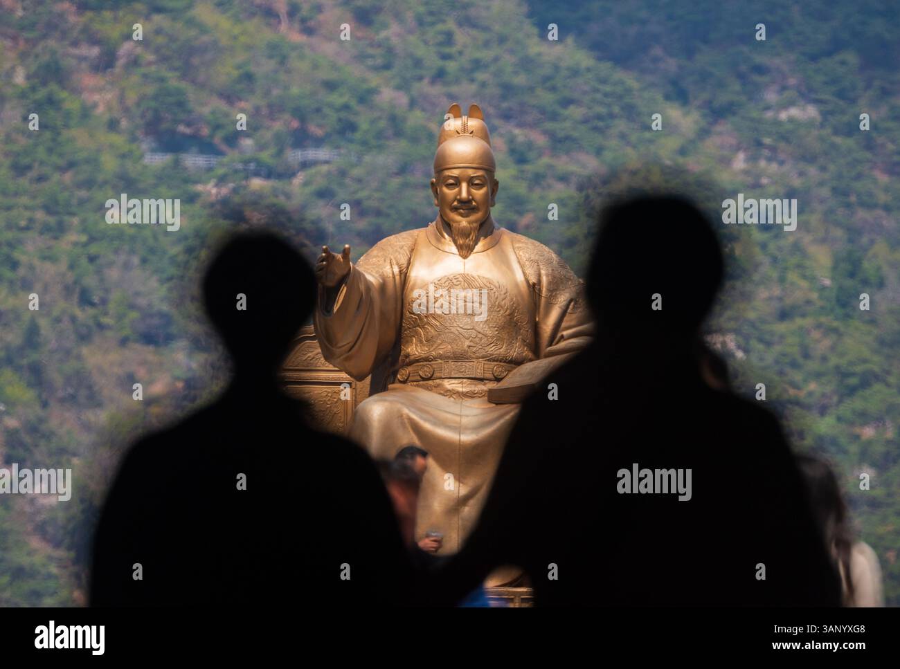 Seoul, South Korea. 15th Apr, 2025. People walk by the statue of King ...