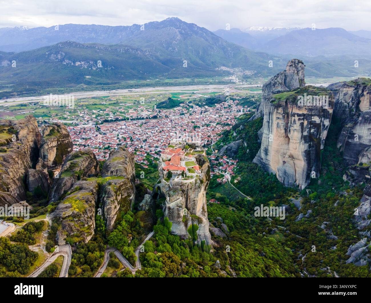 Aerial view of The Holy Trinity Orthodox Monastery with Kalabaka town ...