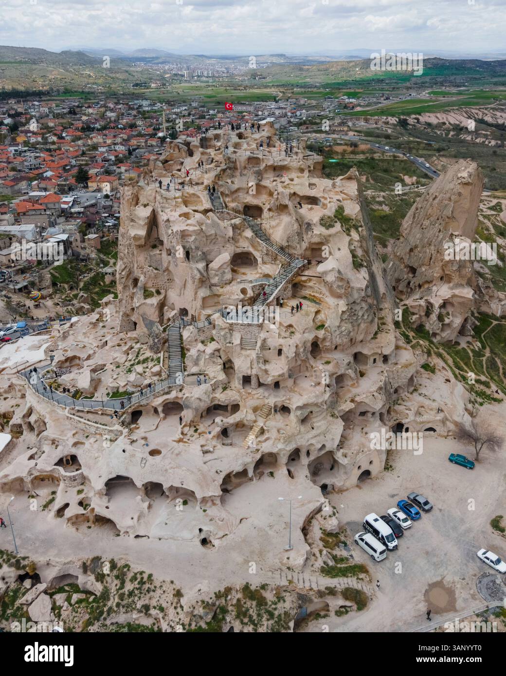 Aerial view of tourists visiting Uchisar Castle in Uchisar old town ...