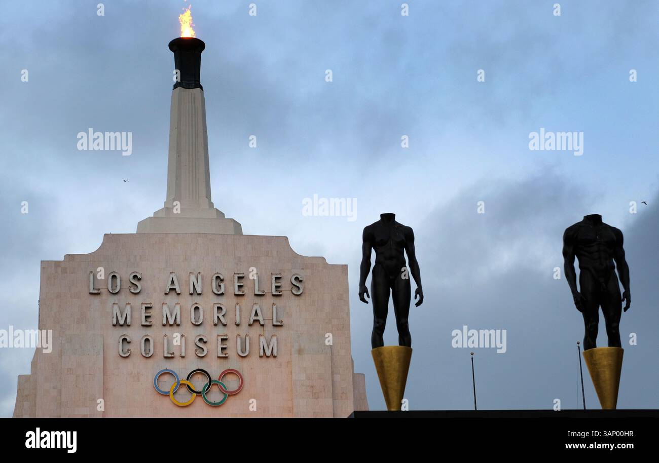 FILE - A blazing Olympic cauldron is seen at the Los Angeles Memorial ...
