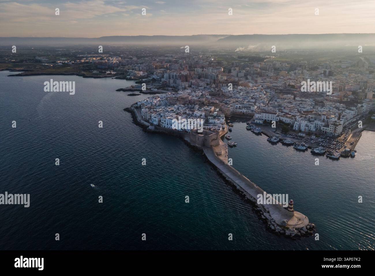 Aerial view of Monopoli old town with Carlo V castle and the lighthouse ...