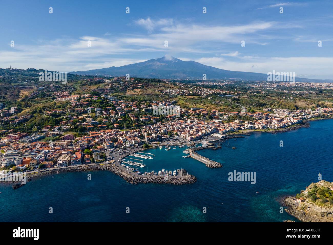Aerial view of Aci Trezza, the Ciclopi Islands and the Etna Volcano ...