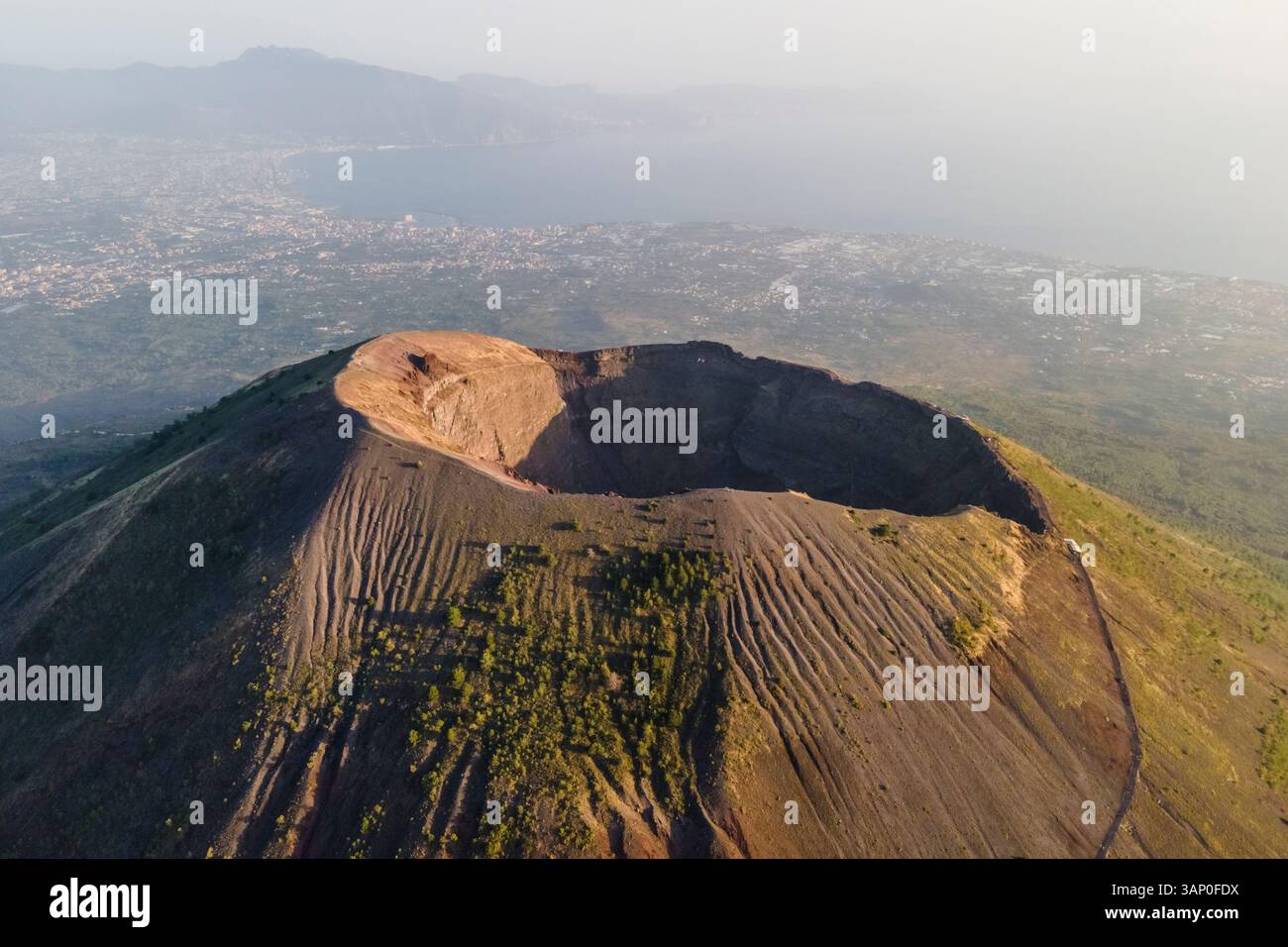 Aerial view of Mount Vesuvius crater at sunset, a volcano in Naples ...