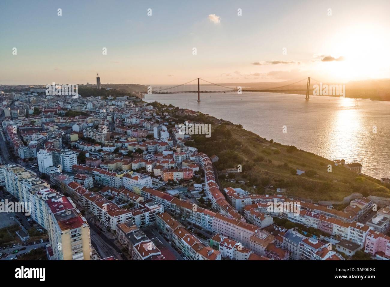 Aerial view of Cacilhas little township along the Tagus river at sunset ...