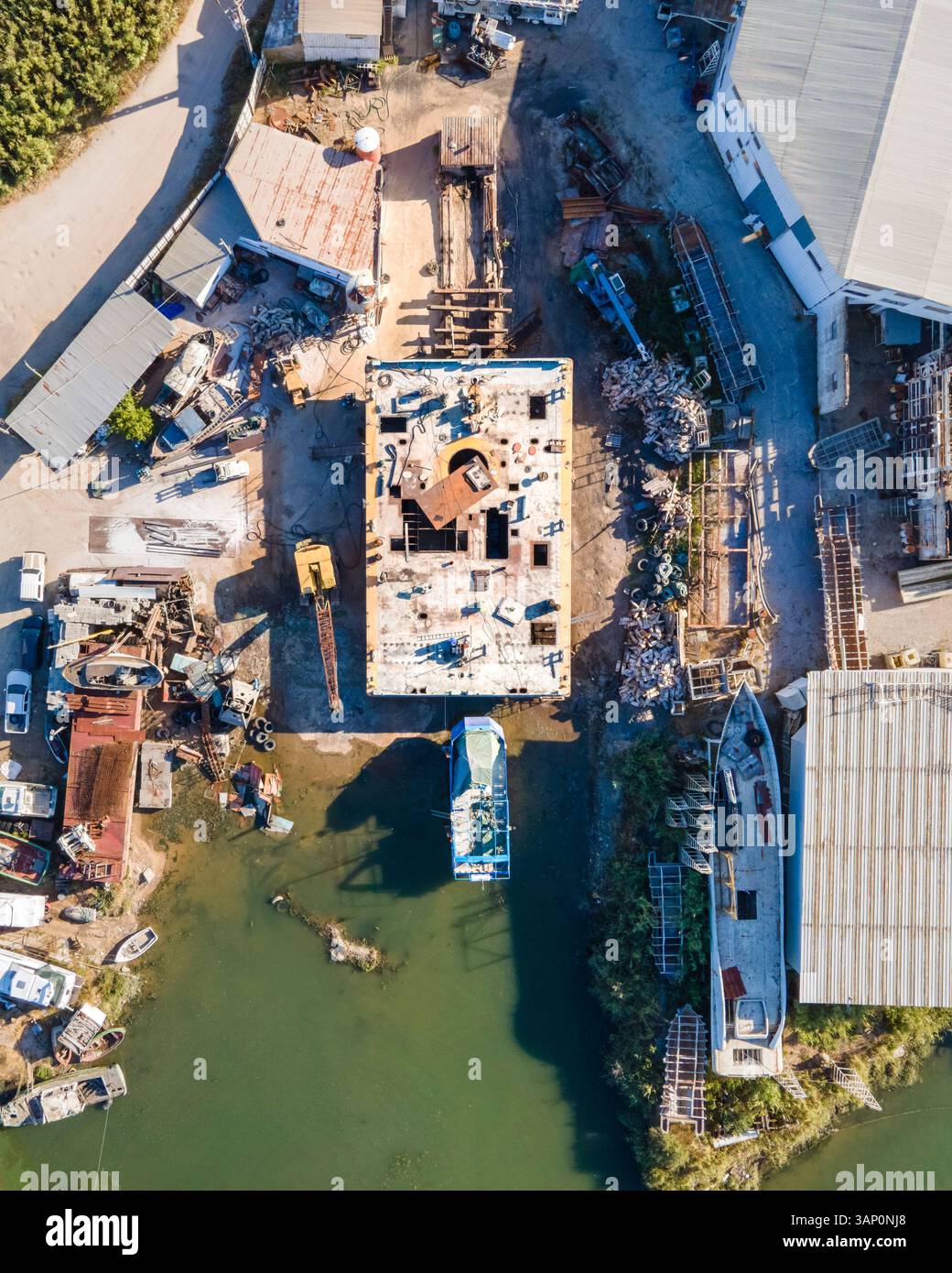 Aerial view of a shipyard along the lagoon in Amora, Setubal, Portugal ...