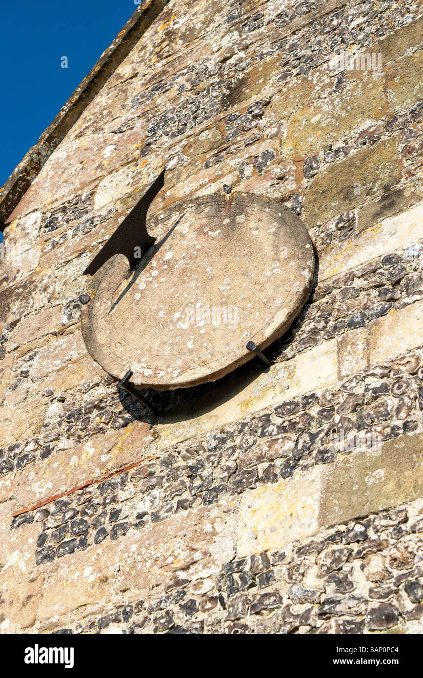 Old stone sun dial clock on church wall Stock Photo - Alamy