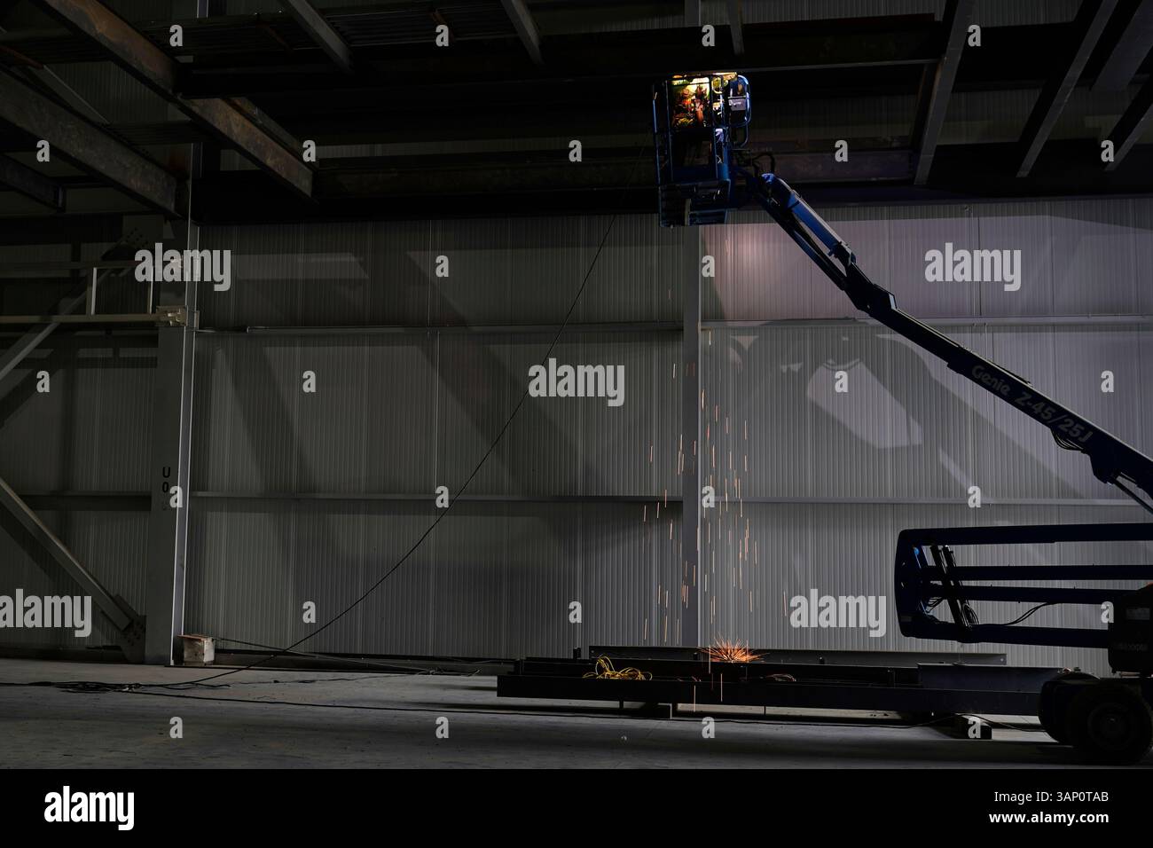 A worker welds a beam at a Scout Motors car plant under construction in ...