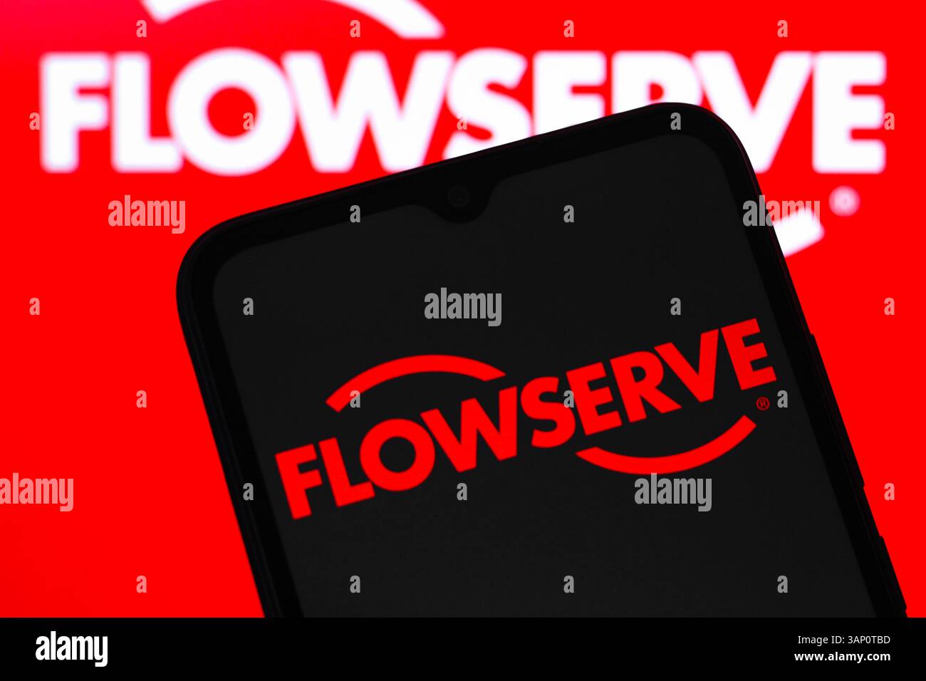 In this photo illustration, the Flowserve Corporation logo is seen displayed on a smartphone ...