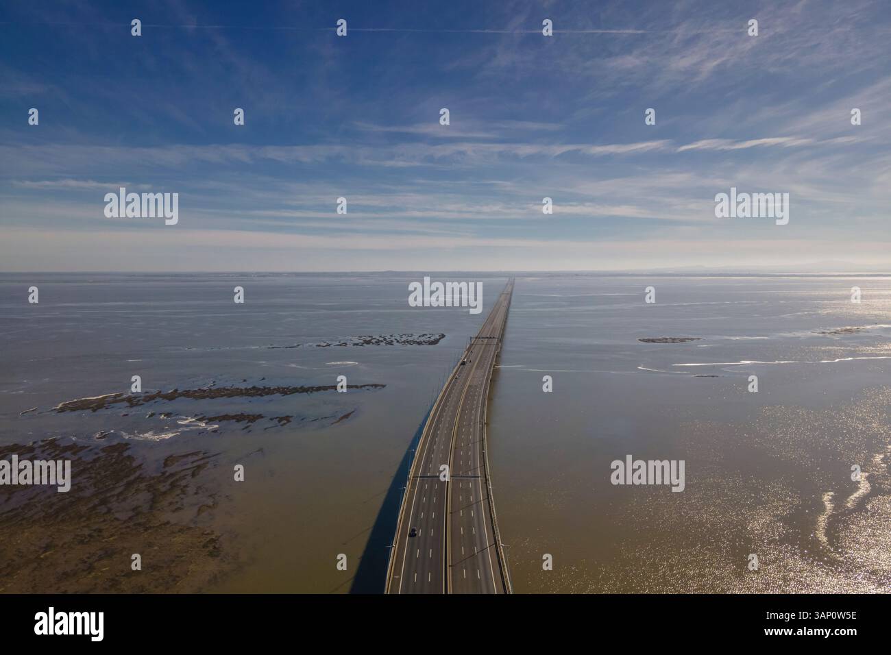 Aerial view of vehicles driving Vasco da Gama suspended bridge crossing ...
