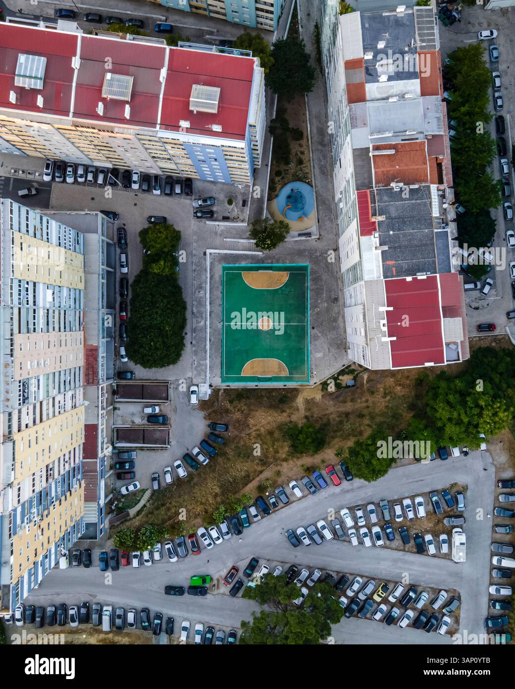 Aerial view of a small football field among buildings in a residential ...