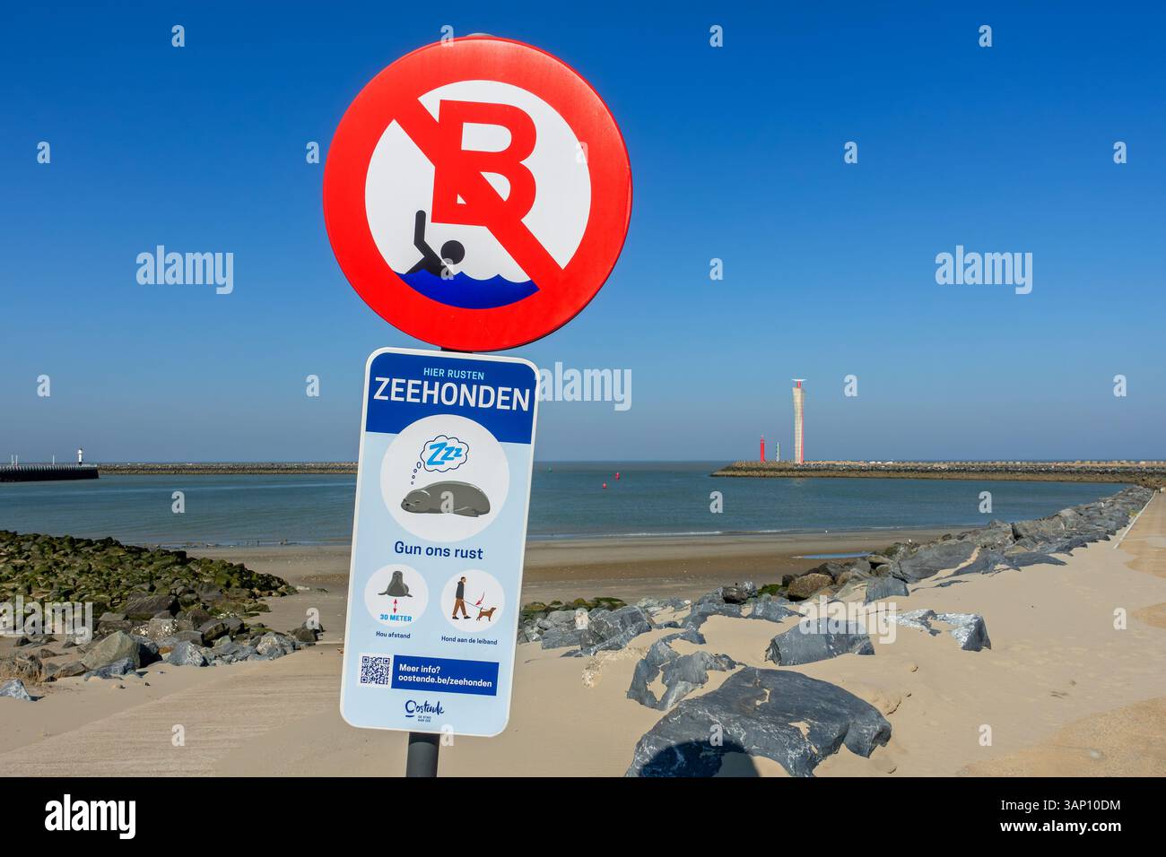 No swimming zone between groynes and sign in front of beach warning ...