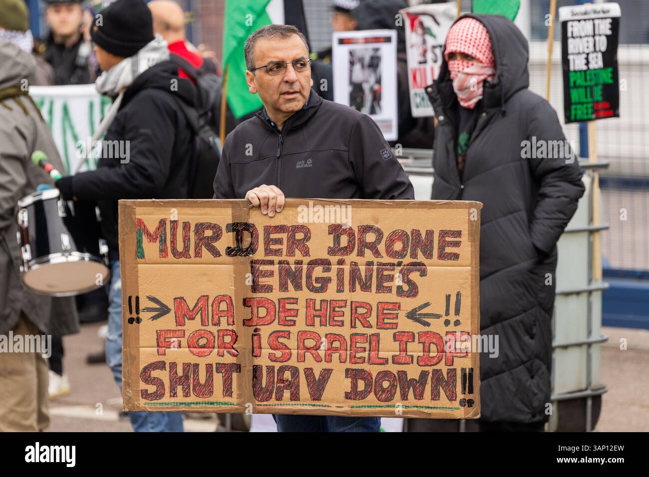 Shenstone, UK. 15 APR, 2025. Man holds "Murder Drone Engines made here ...