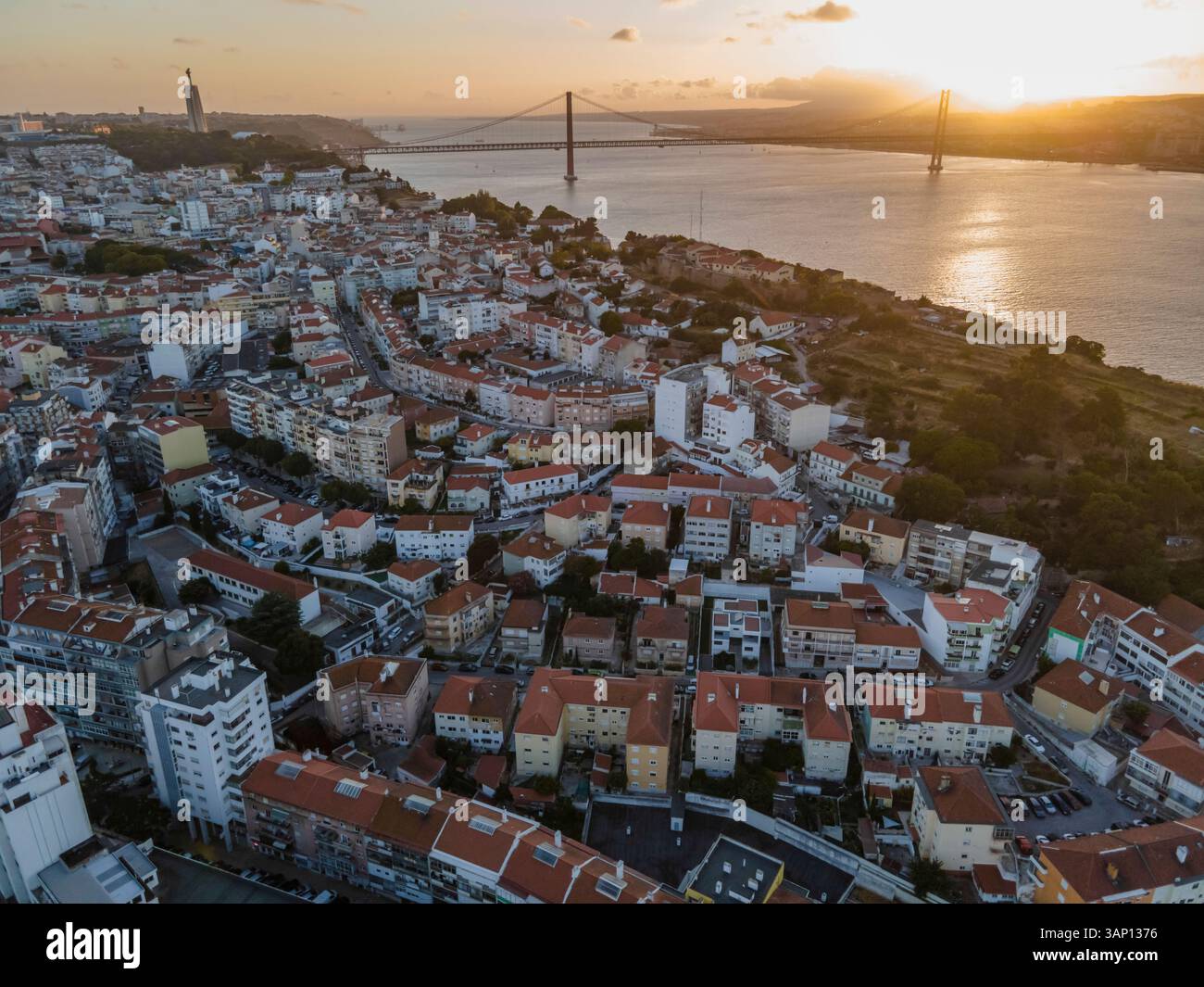 Aerial view of Cacilhas little township along the Tagus river at sunset ...
