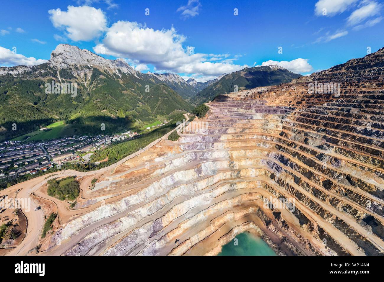 Aerial view of industrial mine in a mountainous landscape with patterns ...