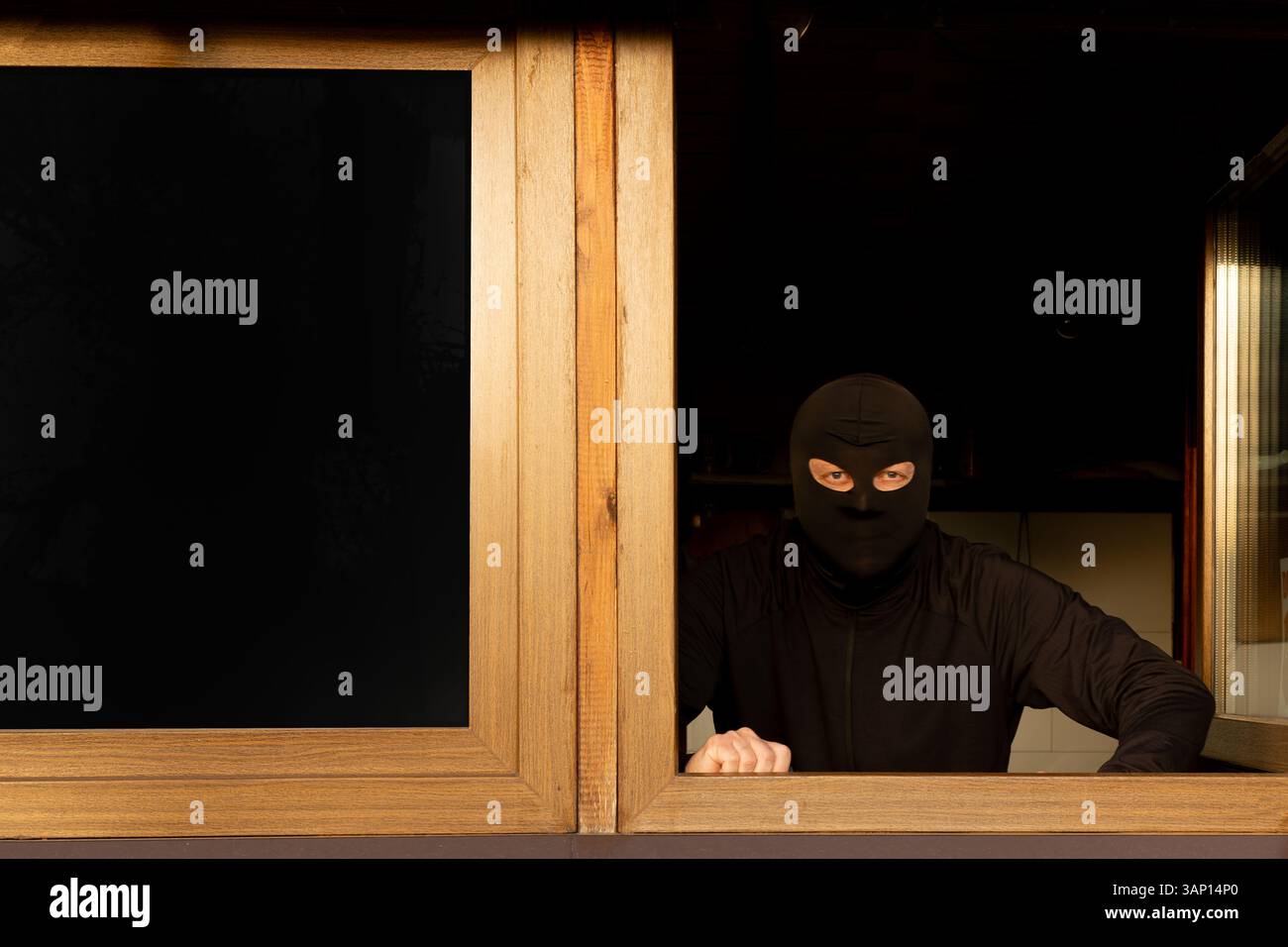 Thief in black cap covering face caught breaking into house, refugee ...