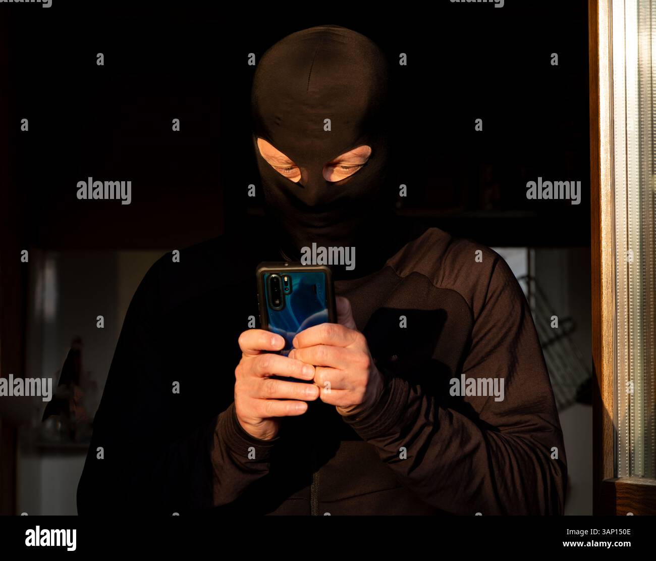 Thief in black cap covering face caught breaking into house, refugee ...