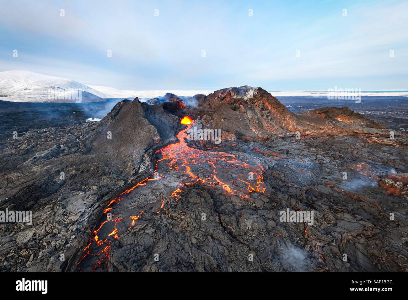 Aerial view of majestic crater and lava flow from volcanic eruption ...