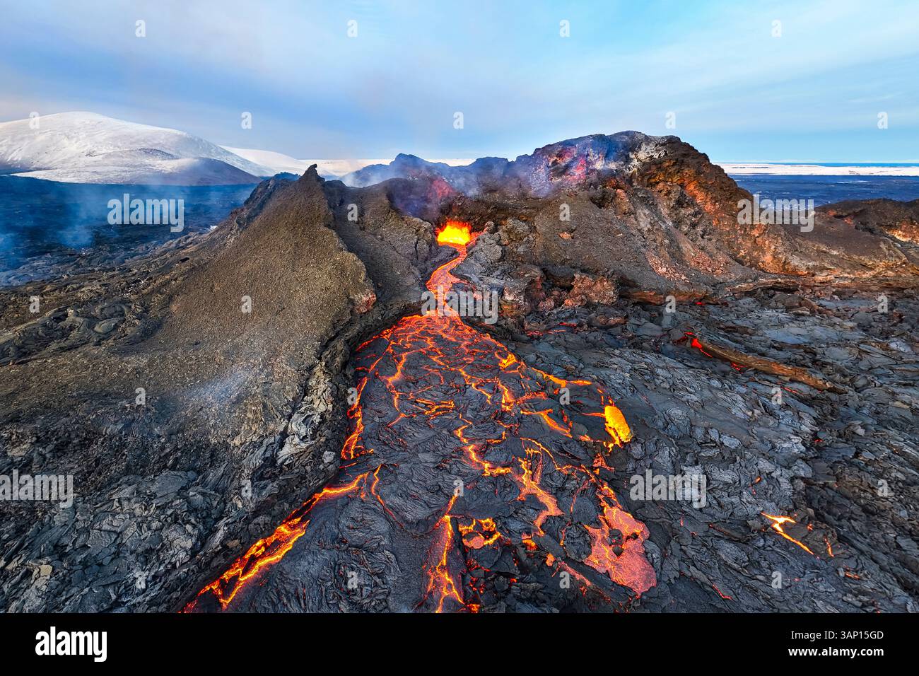 Aerial view of the majestic Sundhnukur volcano with a flowing lava ...