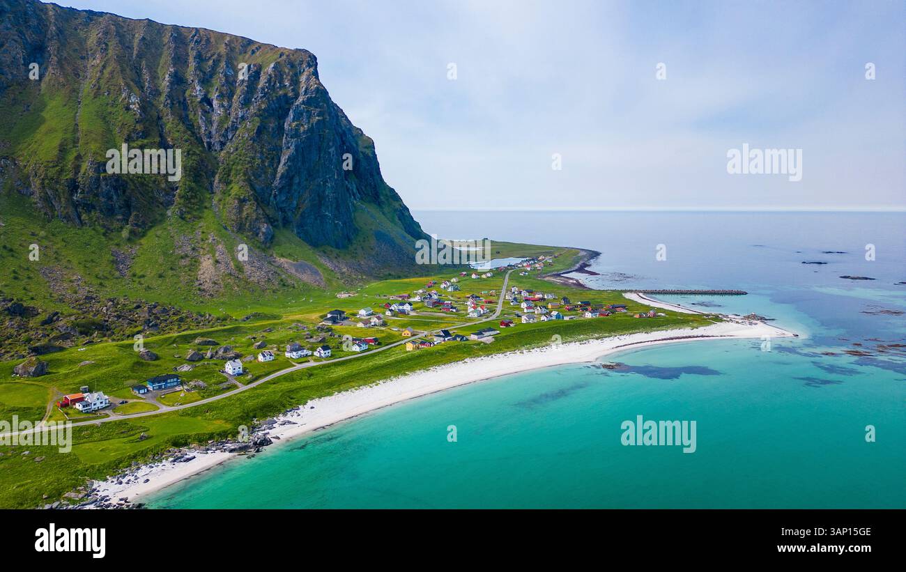 Aerial view of a picturesque norwegian village with a sand beach and clear water alongside a ...