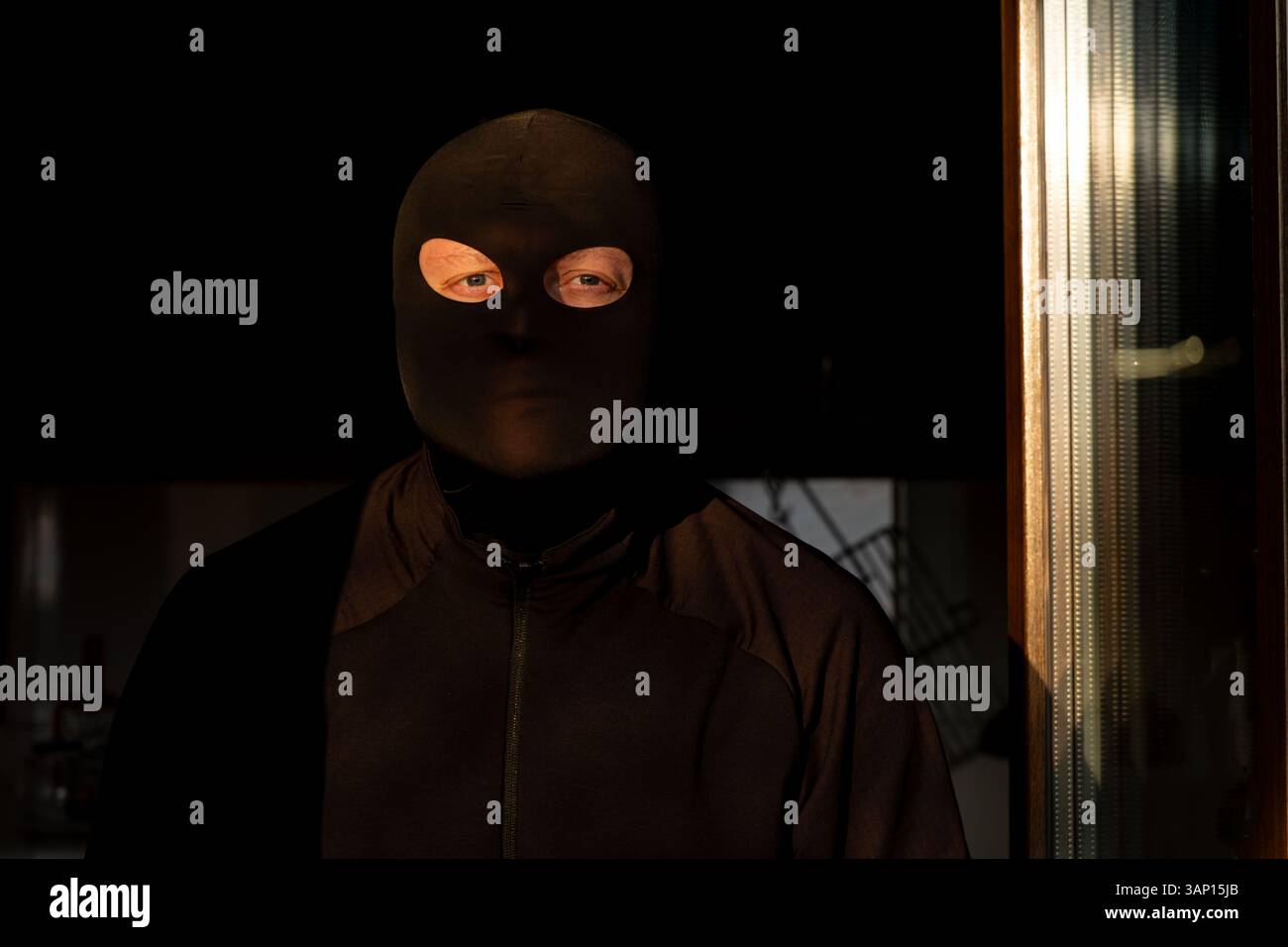 Thief in black cap covering face caught breaking into house, refugee ...