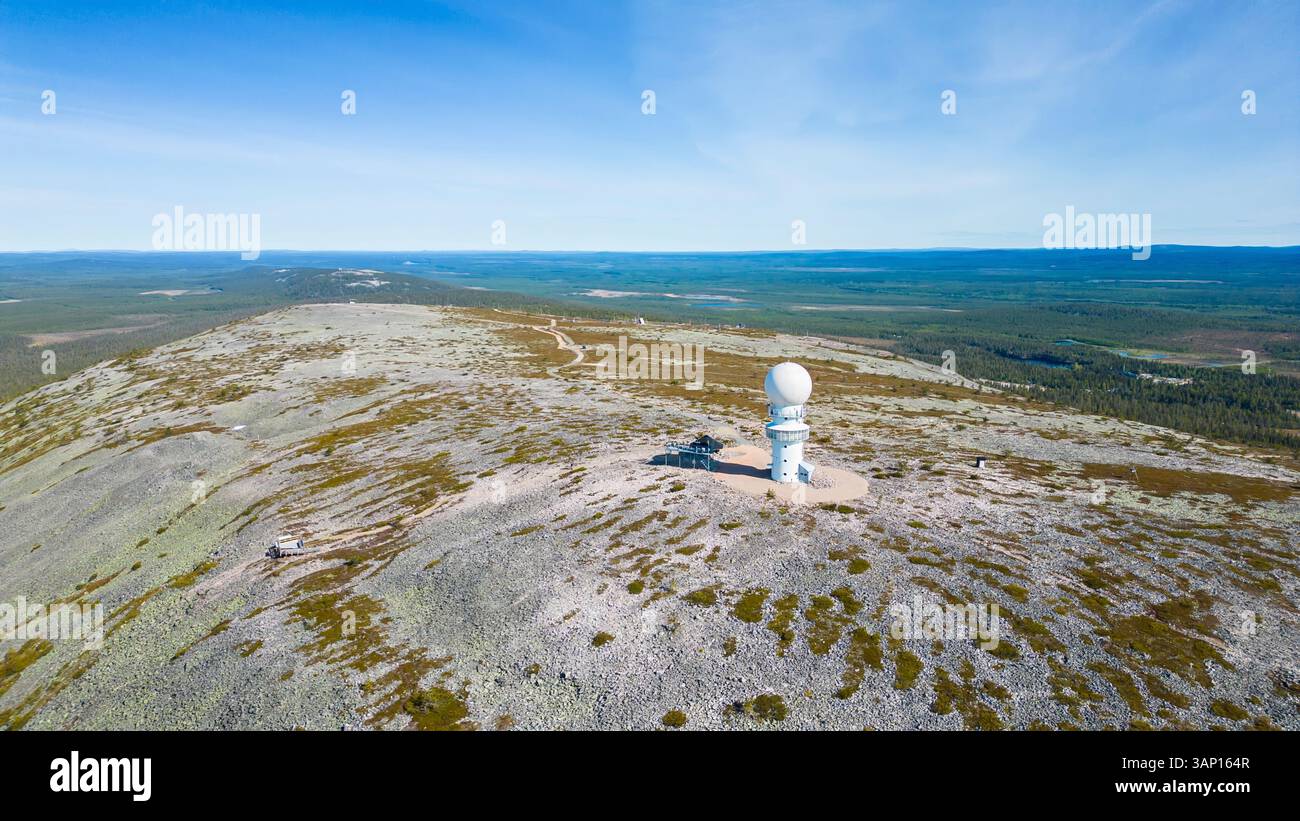Aerial view of a rugged mountain with a radar station amidst unspoiled ...