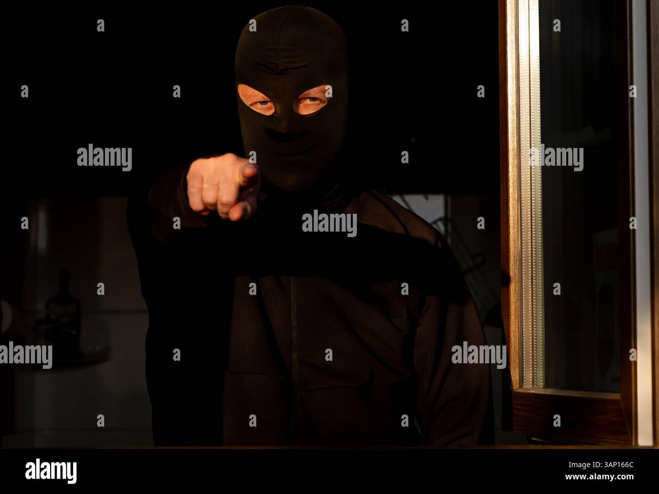 Thief in black cap covering face caught breaking into house, refugee ...