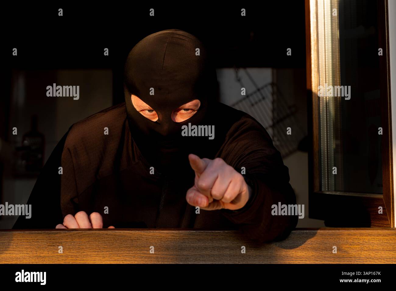 Thief in black cap covering face caught breaking into house, refugee ...