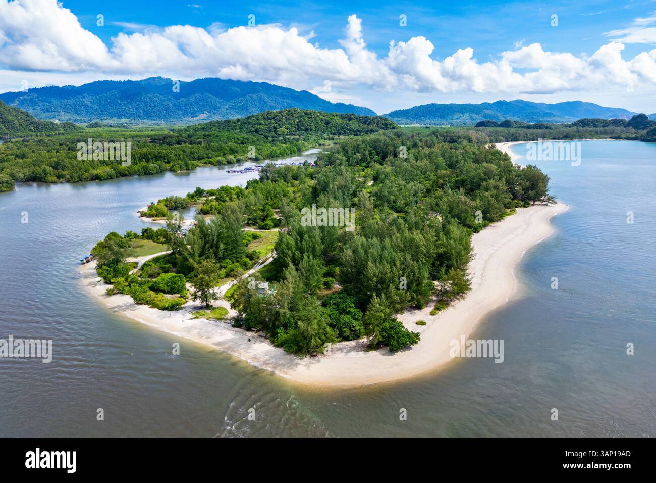 Aerial view of a beautiful beach on a tropical peninsula with lush ...
